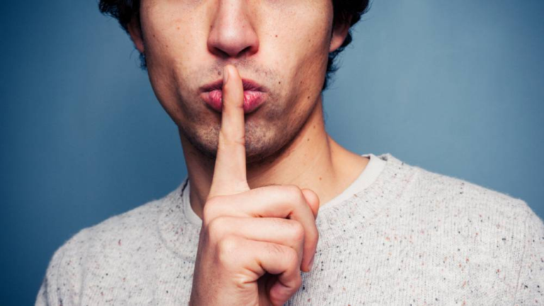 How does posture in body language affect communication?